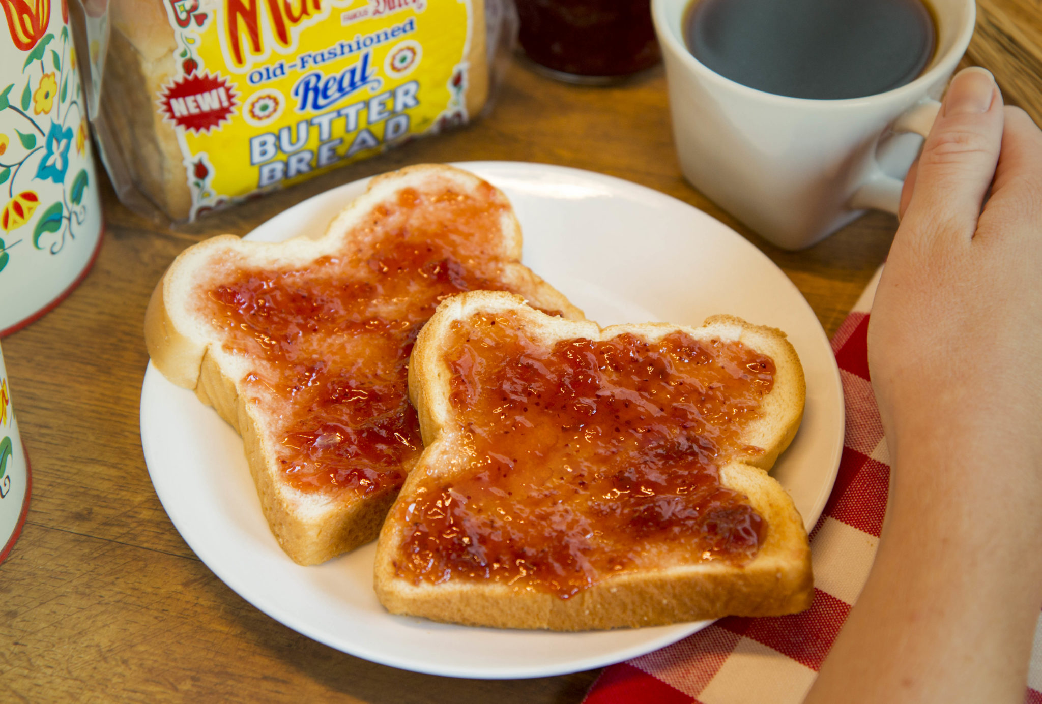 Strawberry Jelly_hand - Martin's Famous Potato Rolls and Bread